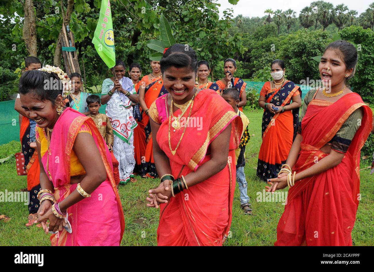 Participants singing while wearing tribal costumes during the ...