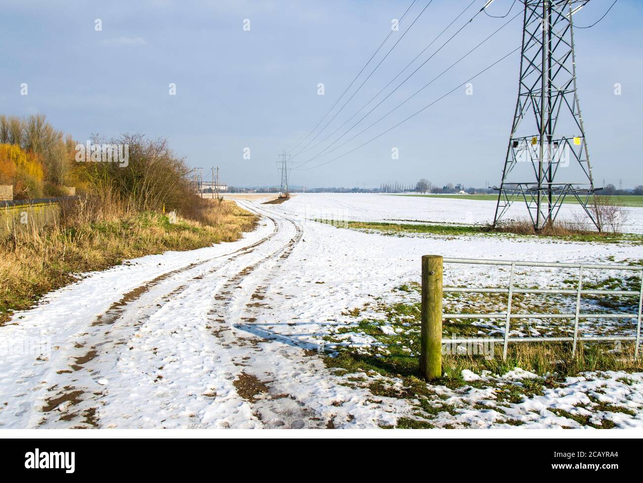 Snowy farm field background Stock Photo - Alamy