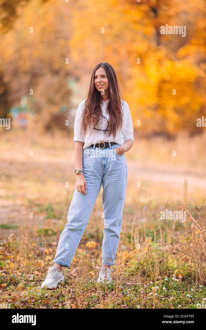 Fall concept - beautiful woman in autumn park under fall foliage Stock ...