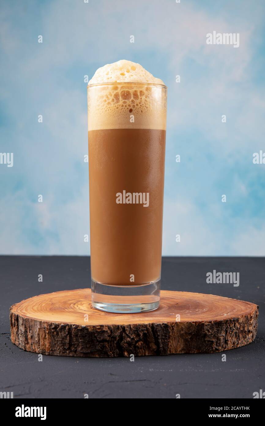 Cold brew or Nitro Coffee drink in the glass with bubble foam. Cold ...