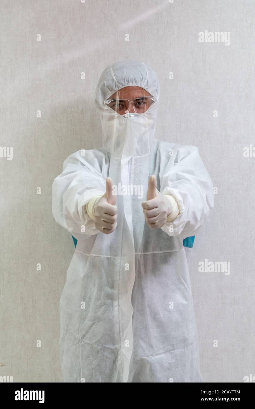 Doctor in PPE suit , face mask and face shield in hospital ward Stock ...