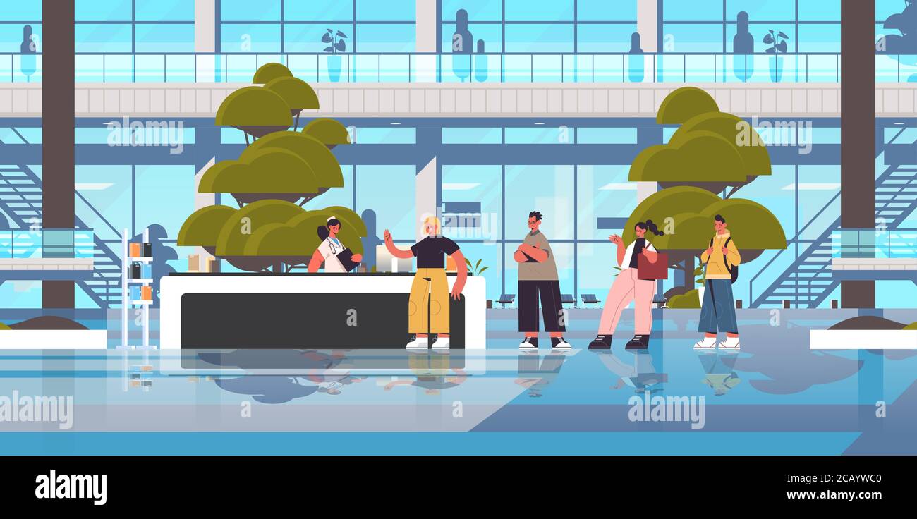 patients standing line queue at reception counter with receptionist ...