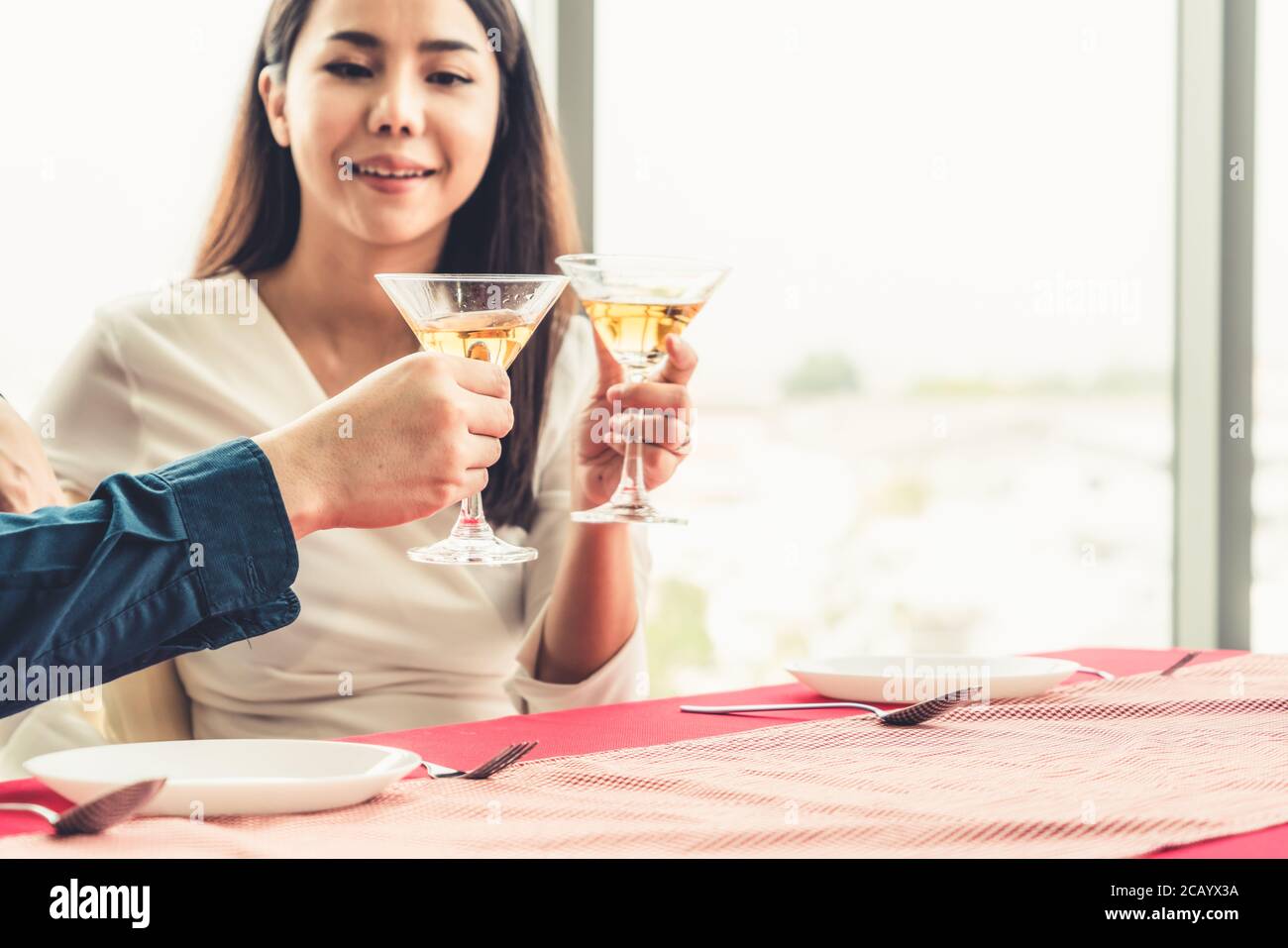 Happy romantic couple eating lunch at restaurant Stock Photo - Alamy