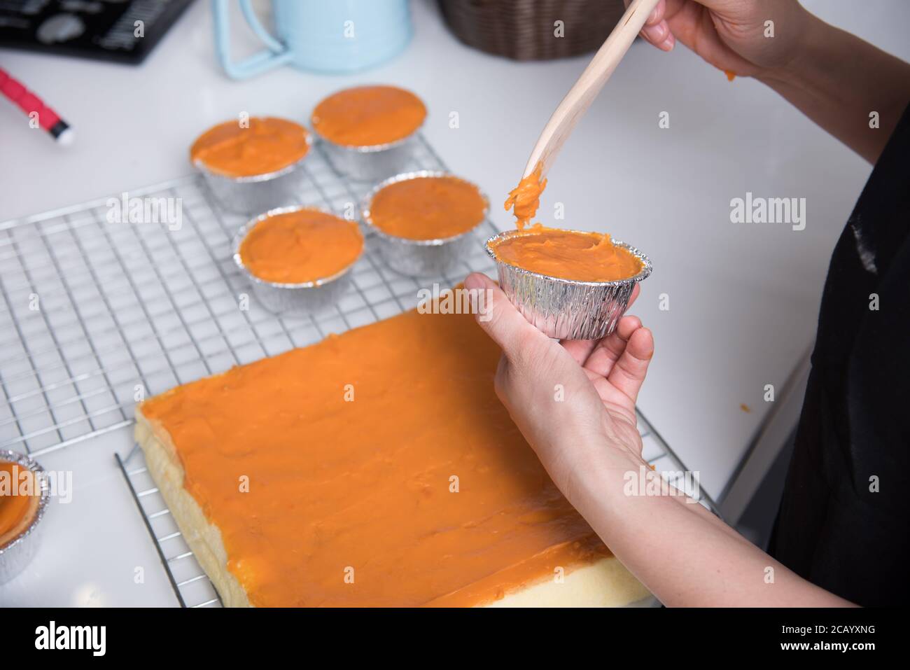 Woman during making decorating cooking bakery cake at homemade Stock ...