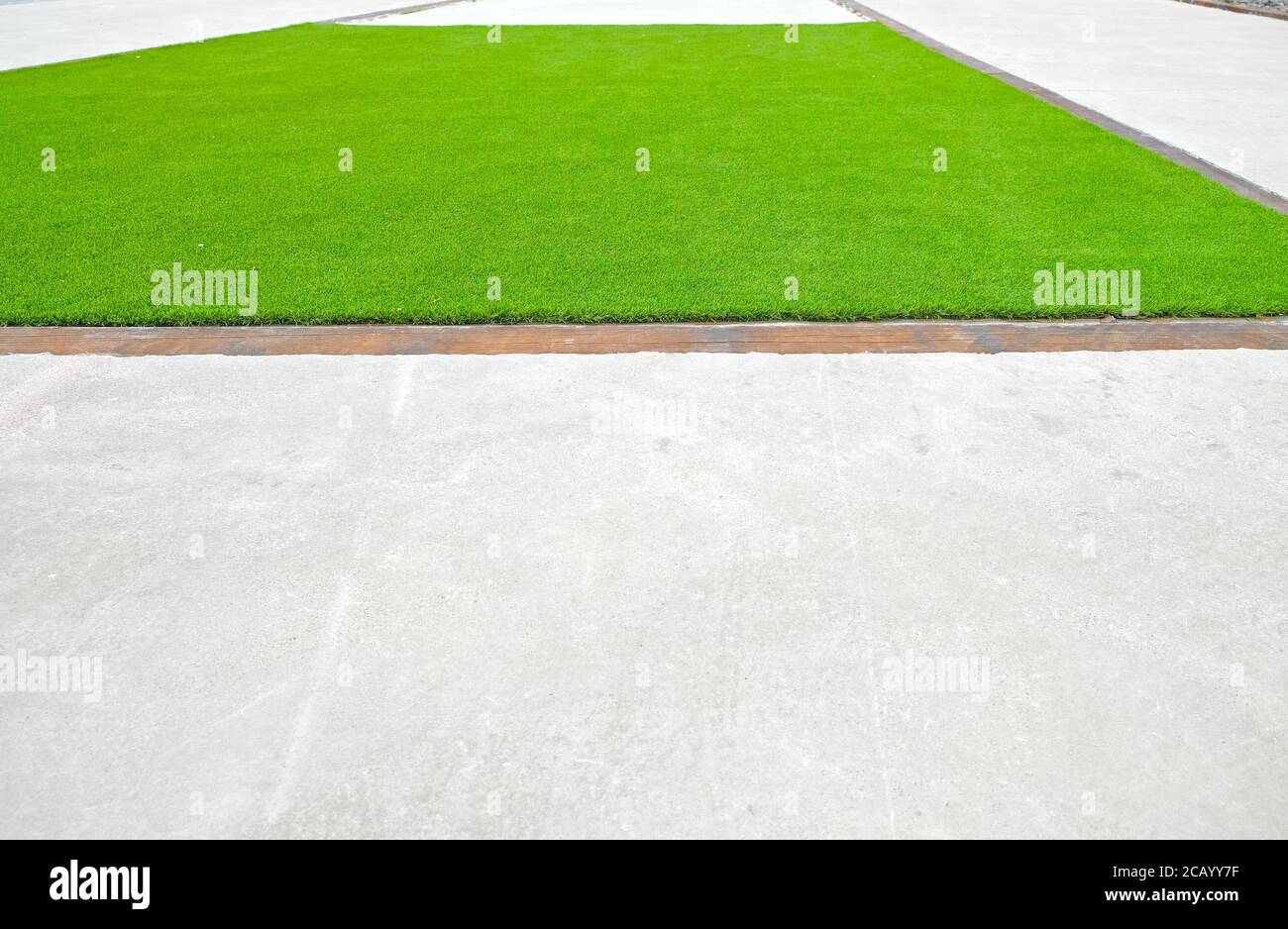 Artificial turf surface used in city landscaping, public park pavement ...