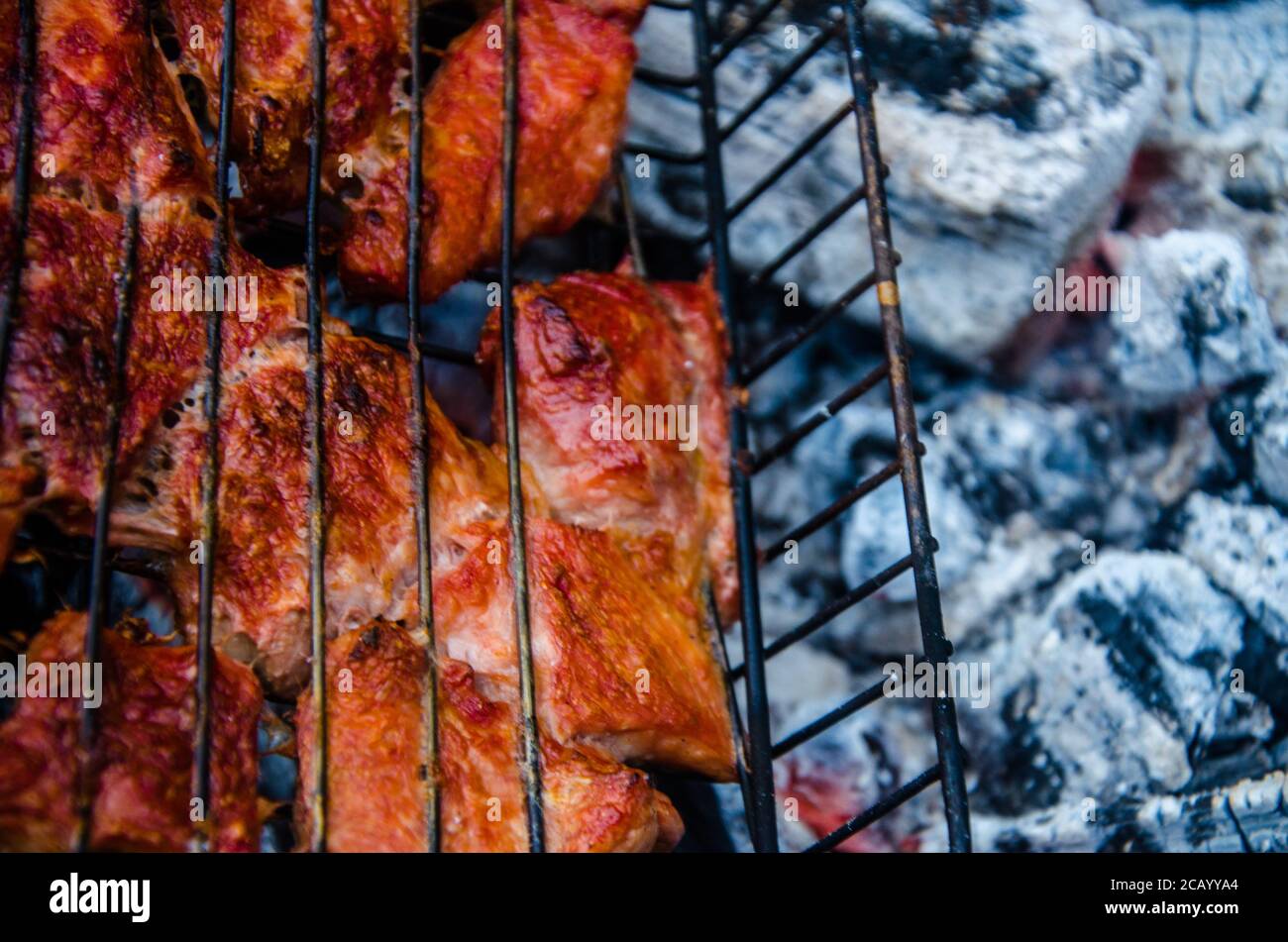 barbecue is prepared on the grill. Smoke from the fire Stock Photo - Alamy