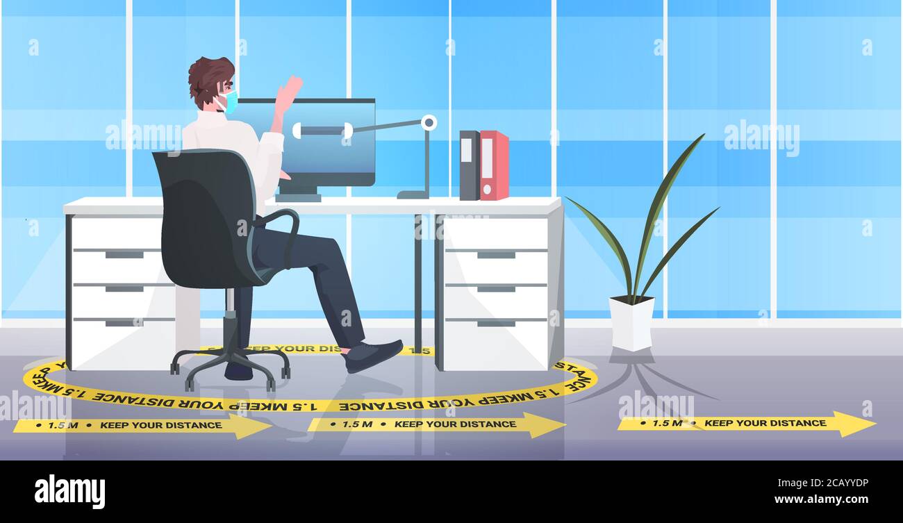 businessman sitting at workplace desk social distancing coronavirus ...