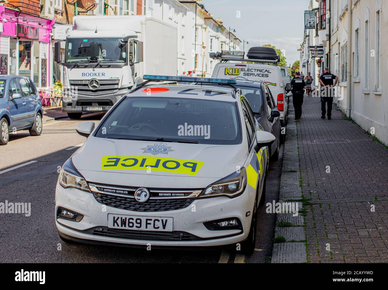 Two police officers walking away from their car in Norfolk Road ...