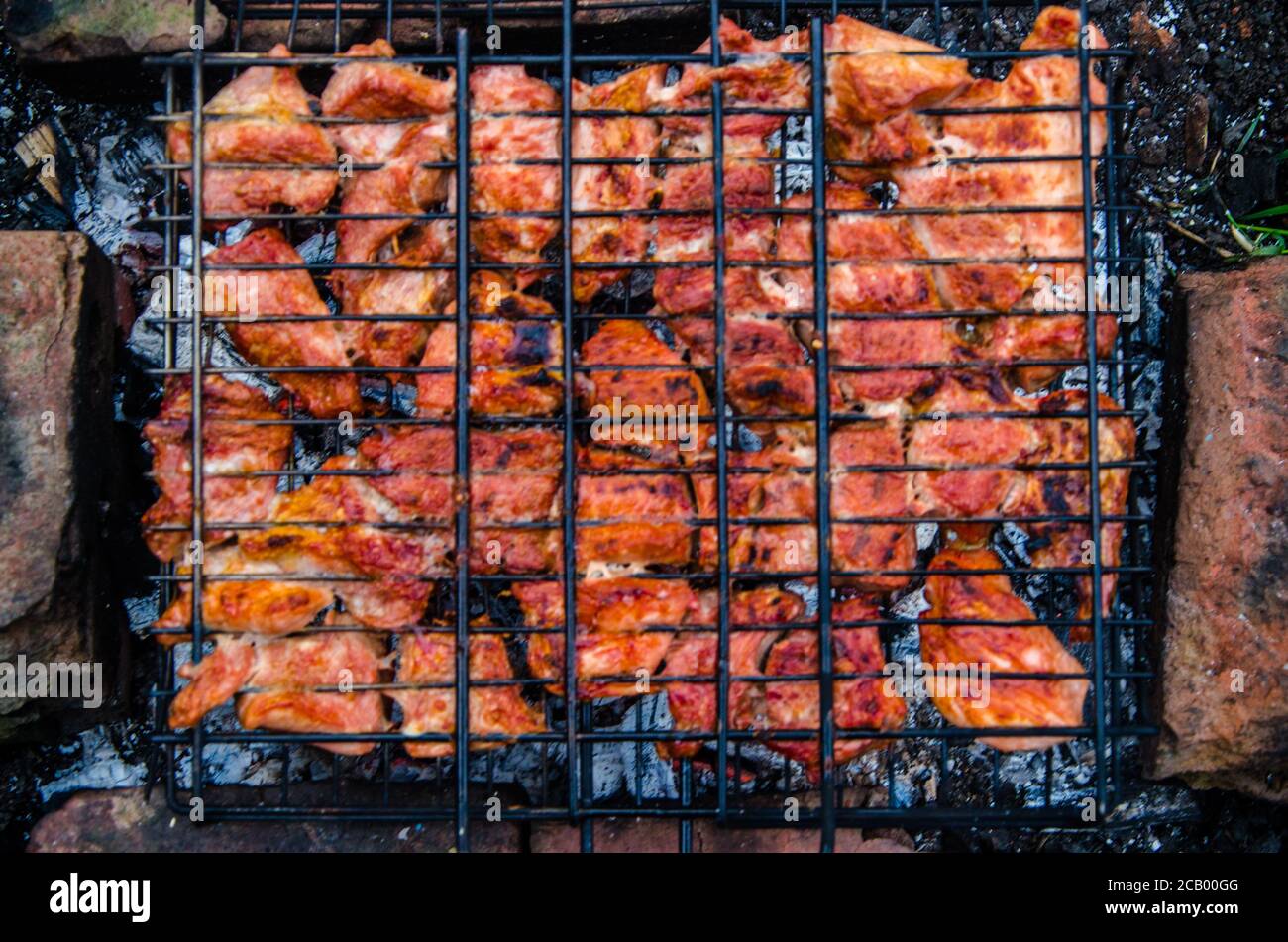 barbecue is prepared on the grill. Smoke from the fire Stock Photo - Alamy