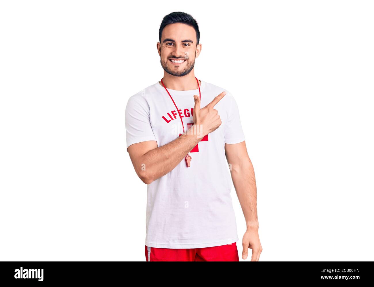 Young handsome man wearing lifeguard uniform cheerful with a smile of ...