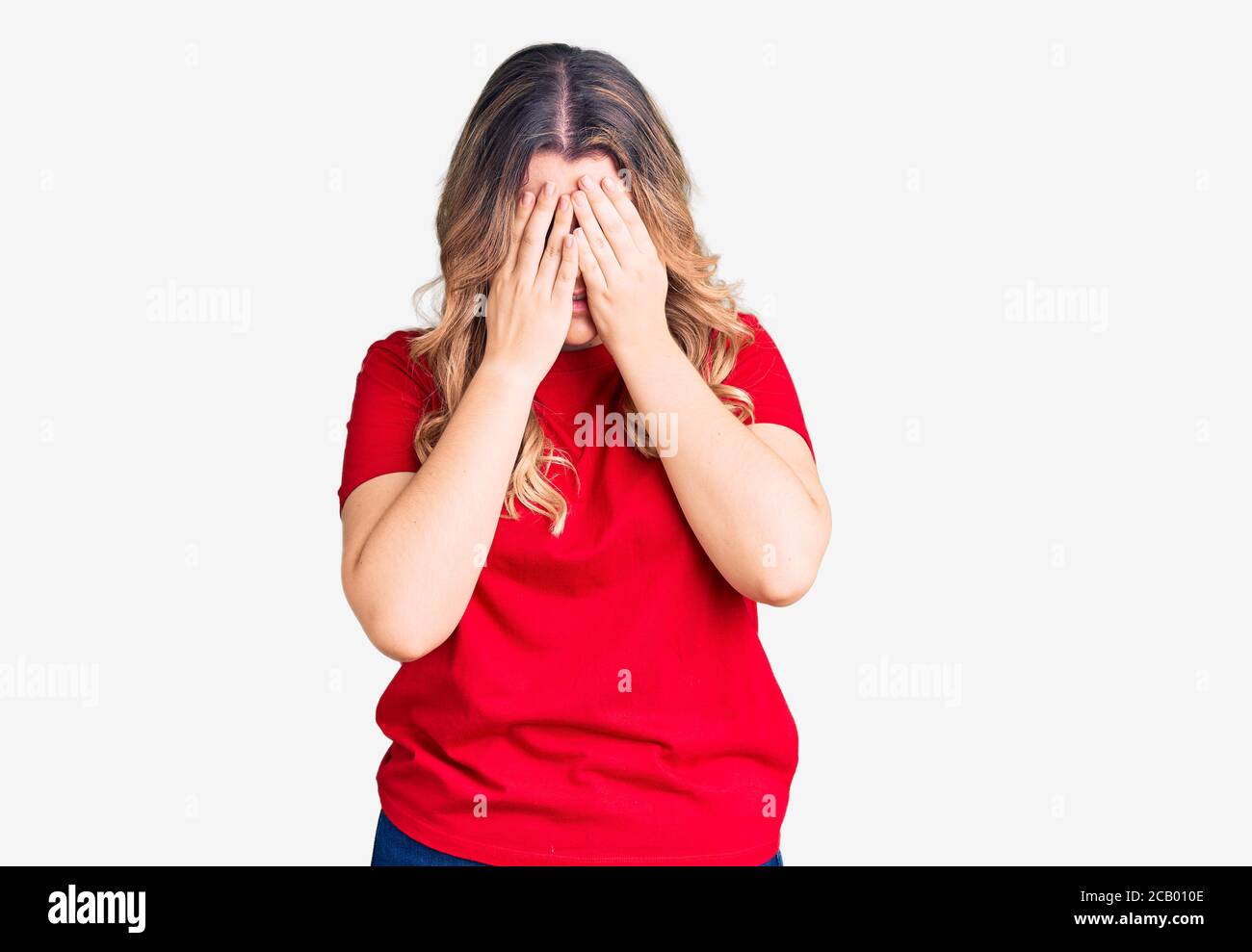Young caucasian woman wearing casual clothes with sad expression ...