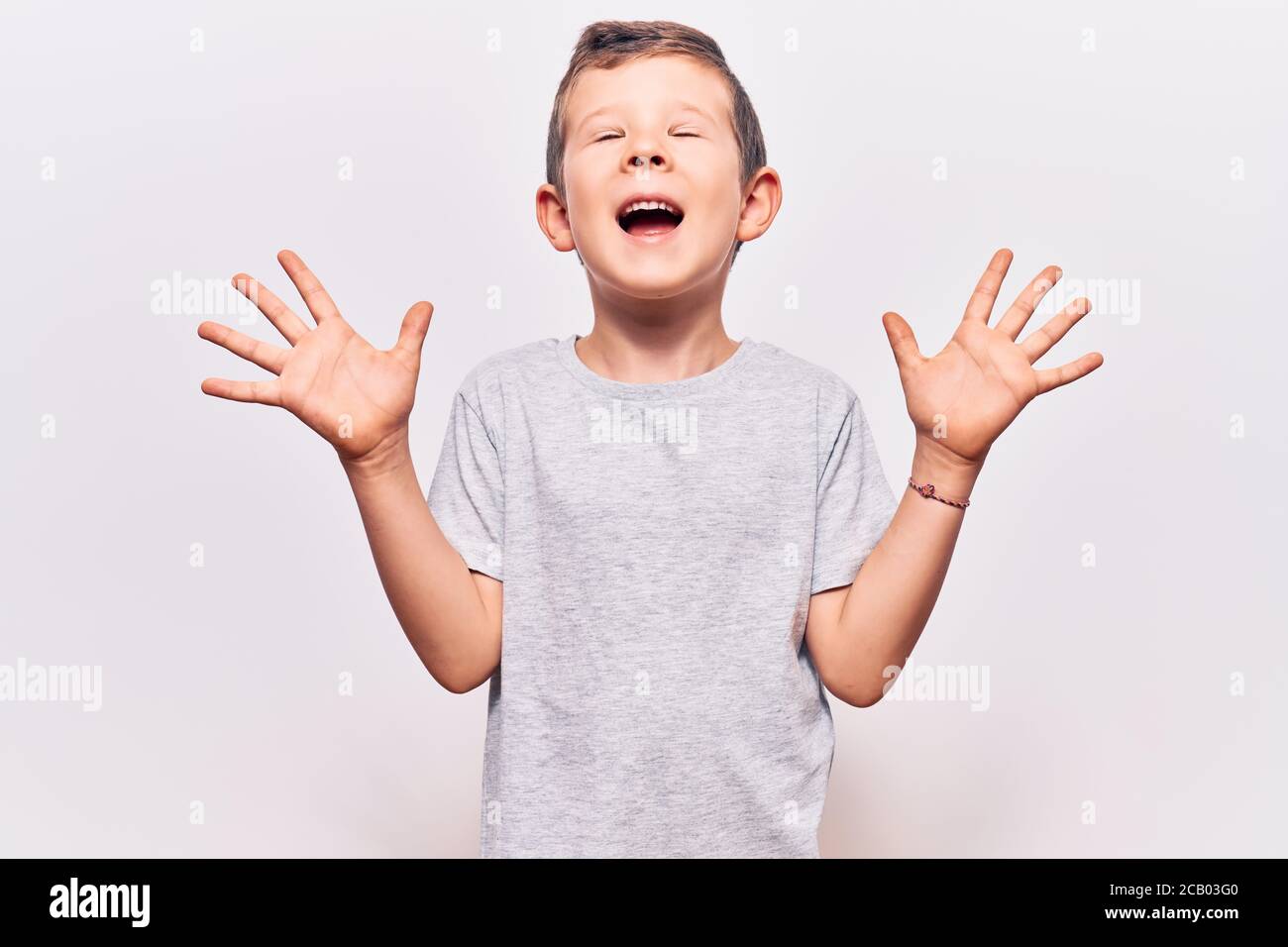 Cute blond kid wearing casual clothes celebrating mad and crazy for ...
