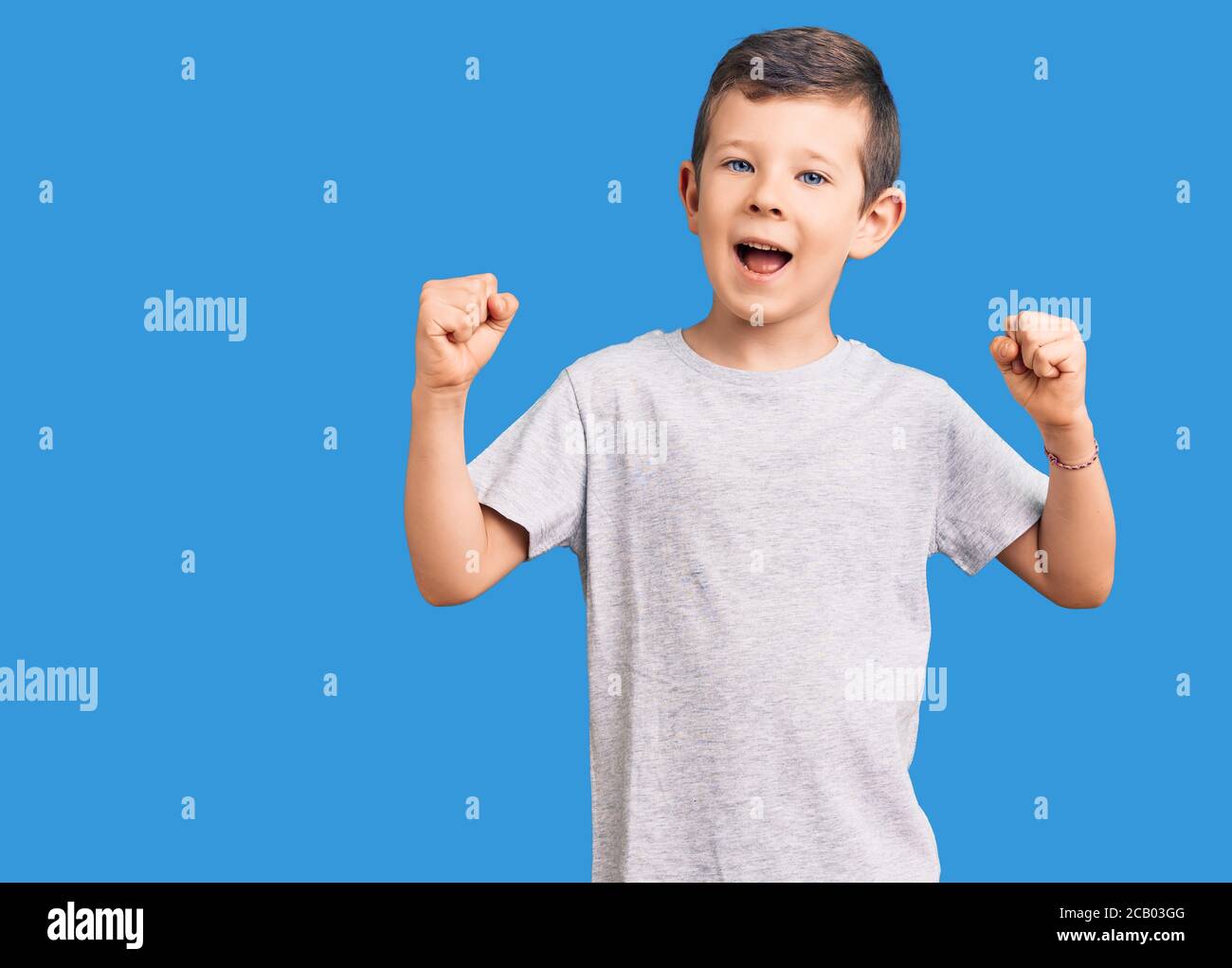 Cute blond kid wearing casual clothes screaming proud, celebrating ...