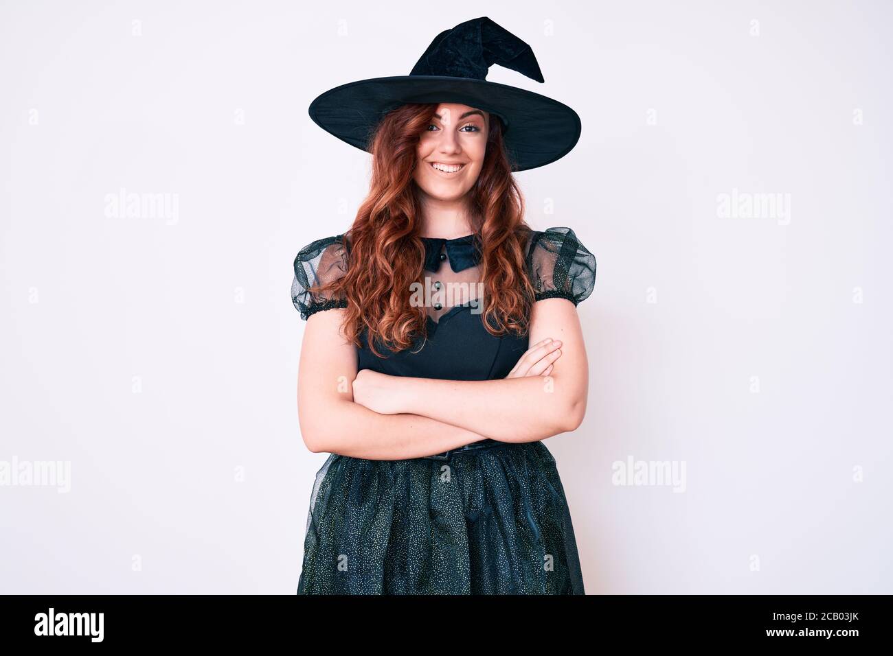 Young beautiful woman wearing witch halloween costume happy face ...