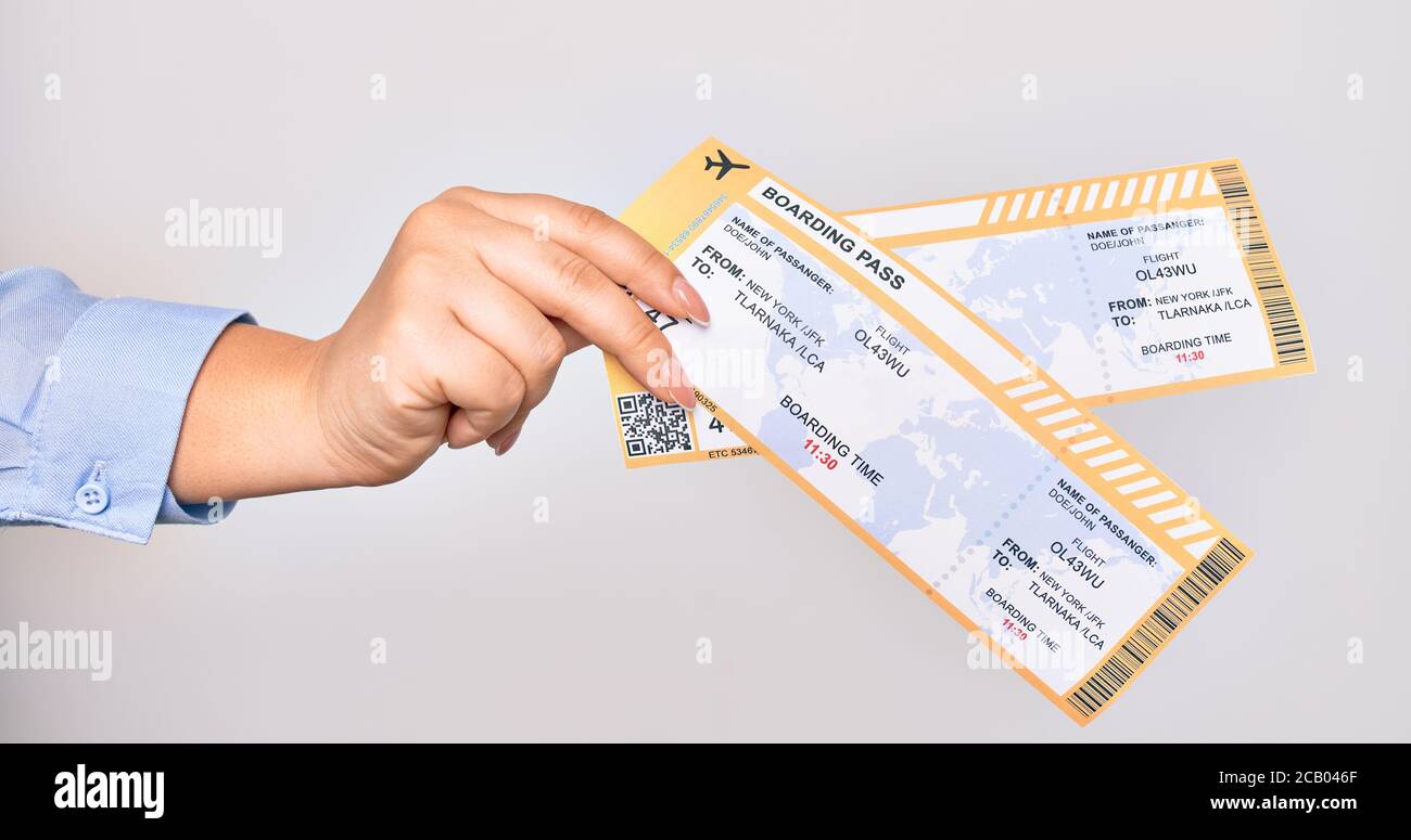 Hand of caucasian young woman holding boarding pass airlane over ...
