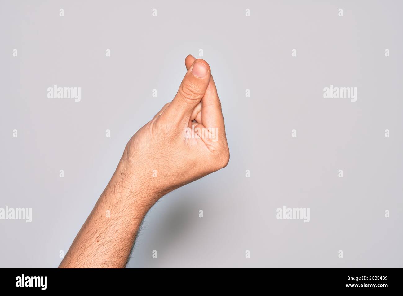 Hand of caucasian young man showing fingers over isolated white ...
