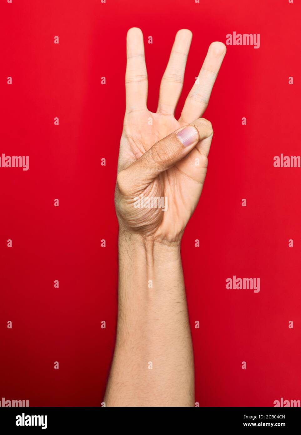 Hand showing three fingers close up hi-res stock photography and images ...