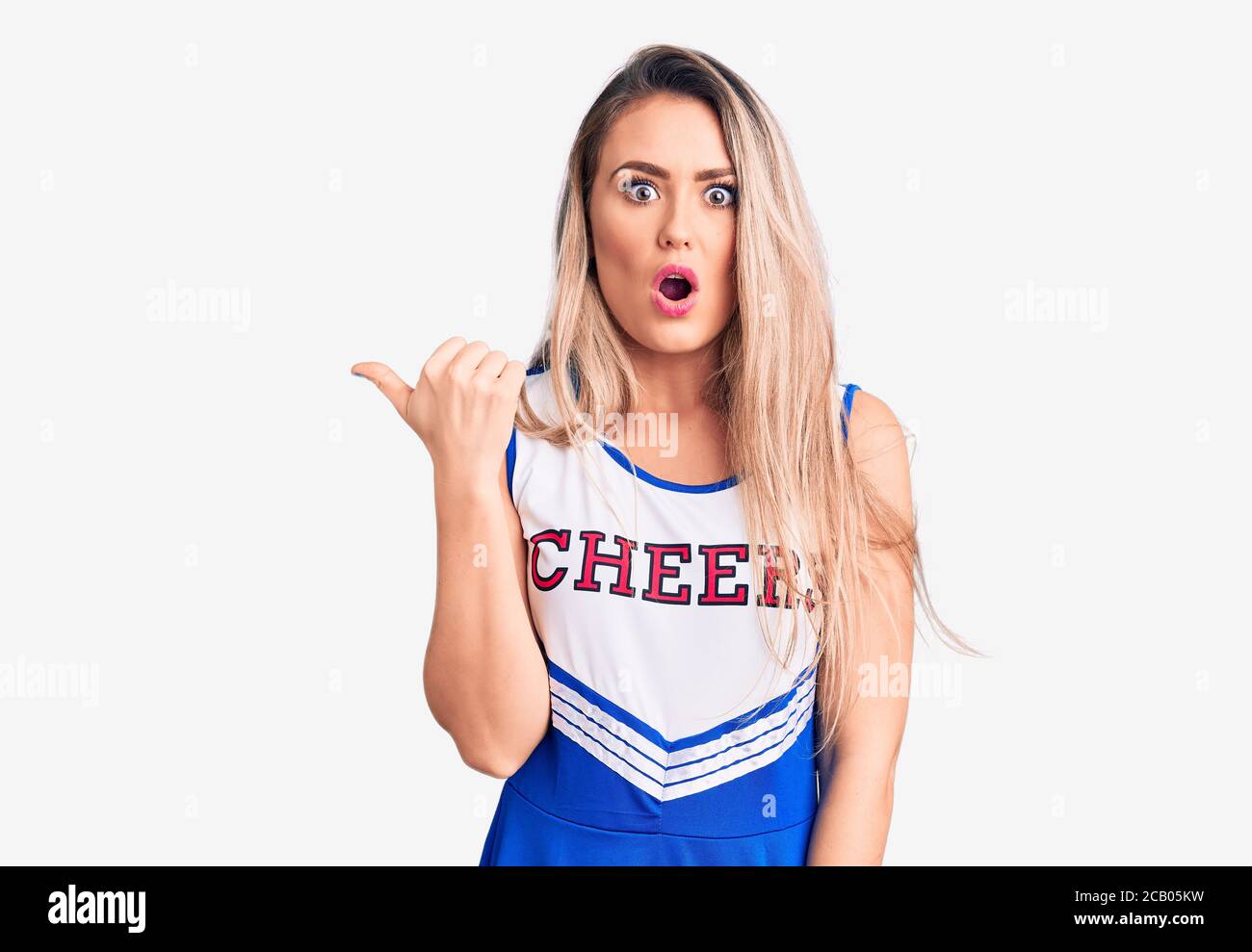 Young Beautiful Blonde Woman Wearing Cheerleader Uniform Surprised