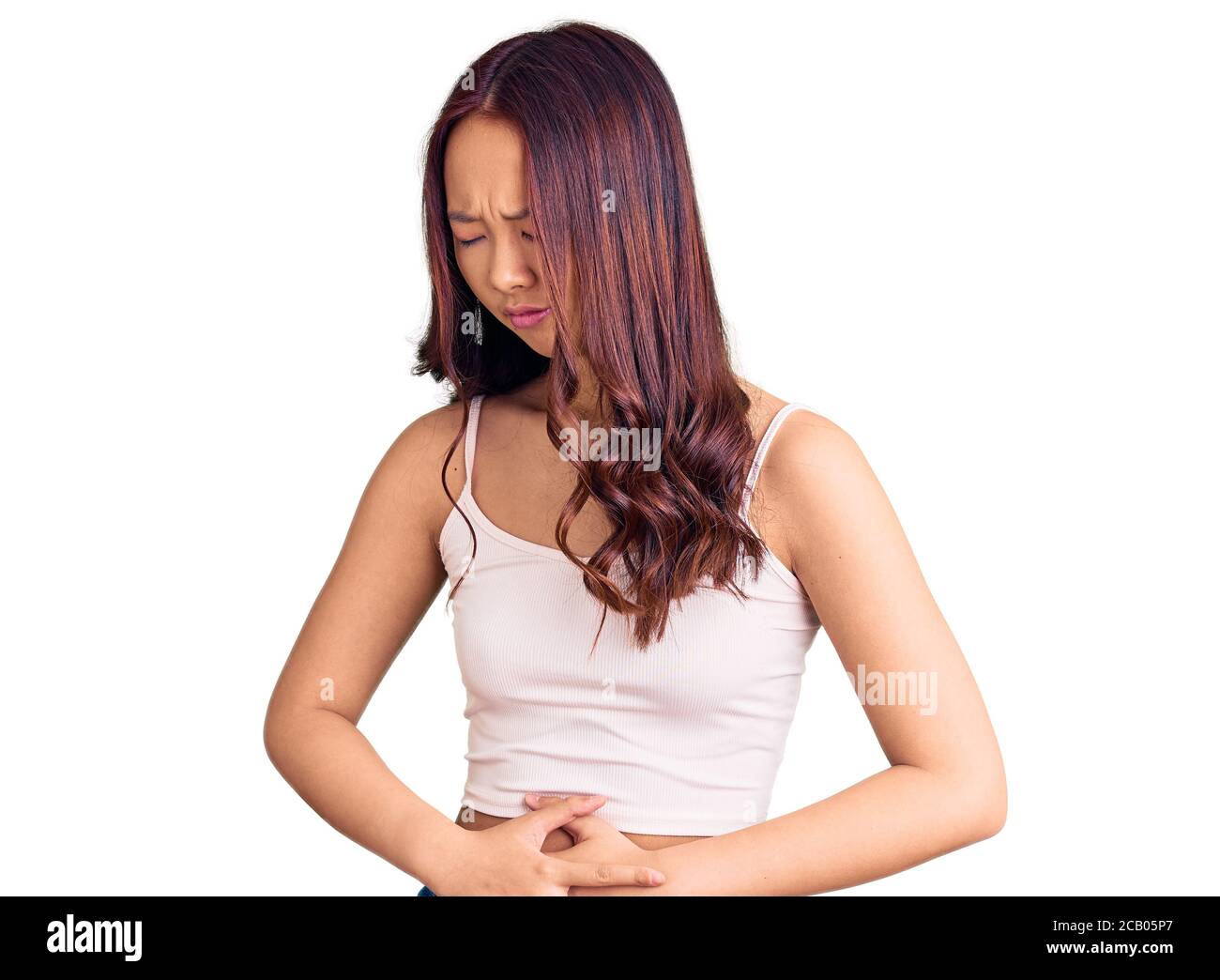 Young beautiful chinese girl wearing casual clothes with hand on ...