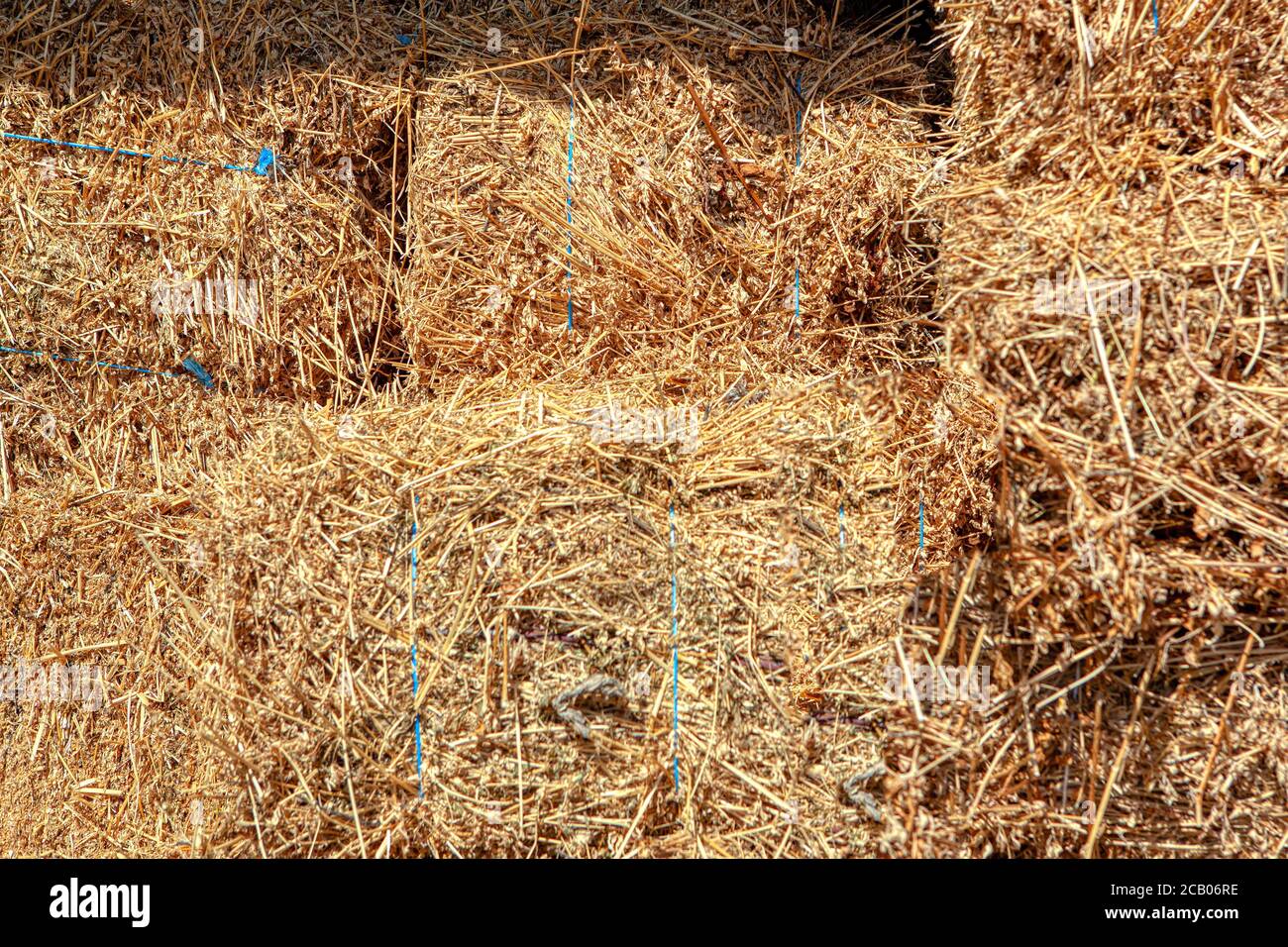 Stacked hay background . Straw for domestic animals feeding Stock Photo ...