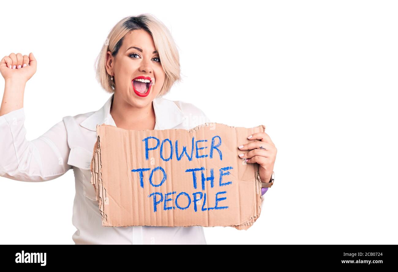 Young blonde plus size woman holding power to the people banner ...