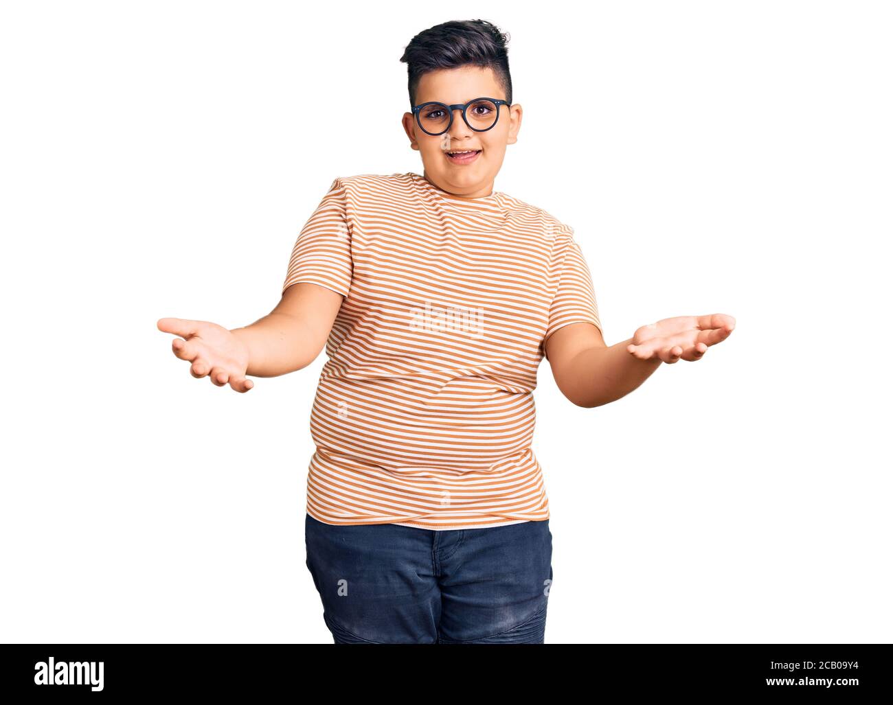 Little boy kid wearing casual clothes and glasses smiling cheerful ...