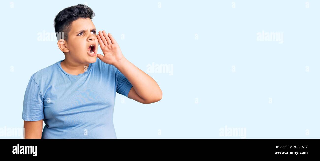 Little boy kid wearing sports workout clothes shouting and screaming ...