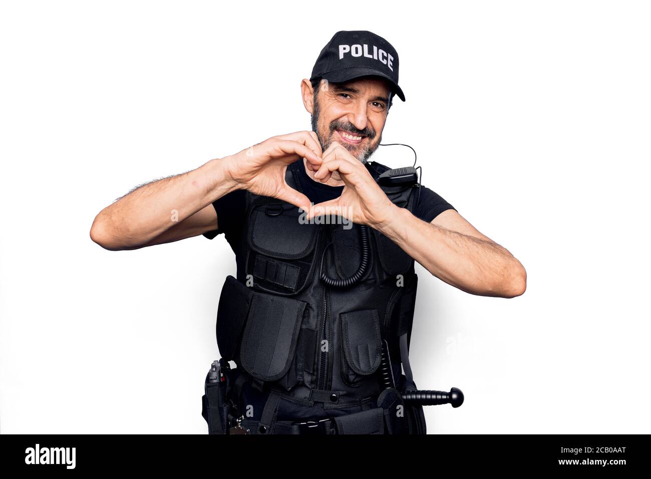 Middle age policeman wearing police uniform and bulletproof vest over ...