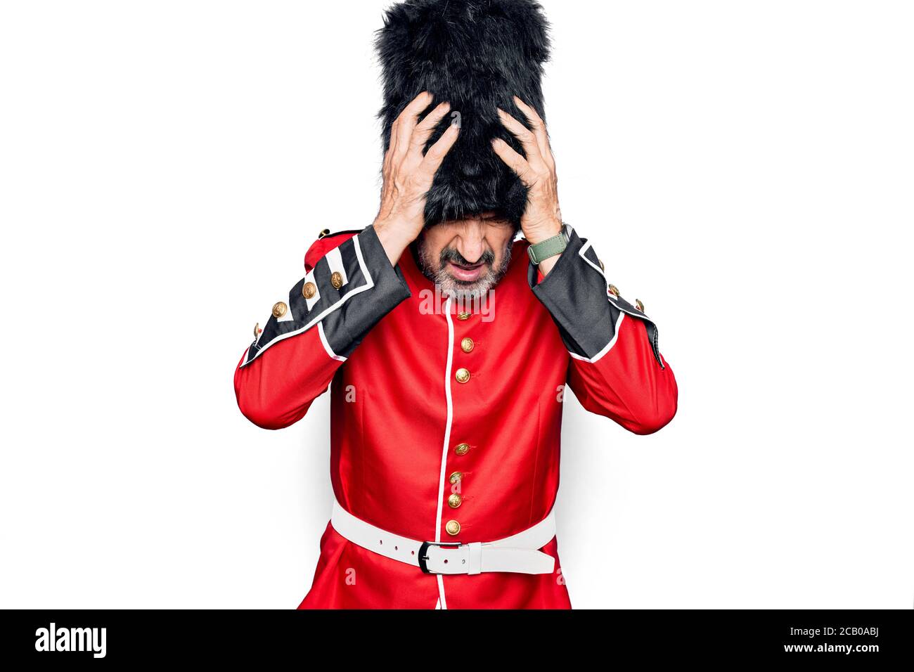 Middle age handsome wales guard man wearing traditional uniform over ...