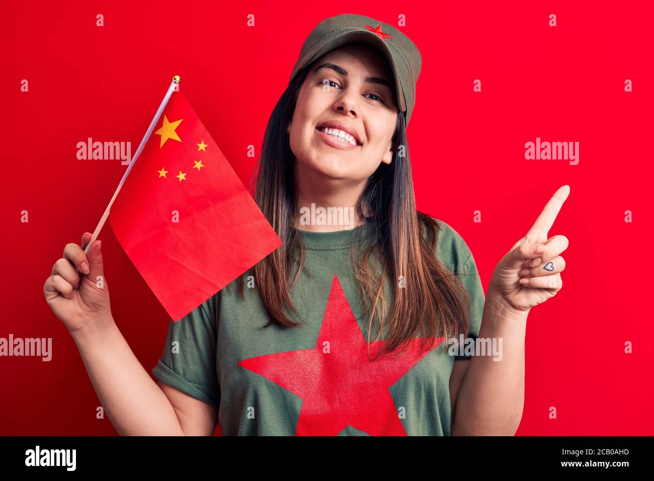 Beautiful patriotic woman wearing t-shirt with red star communist ...