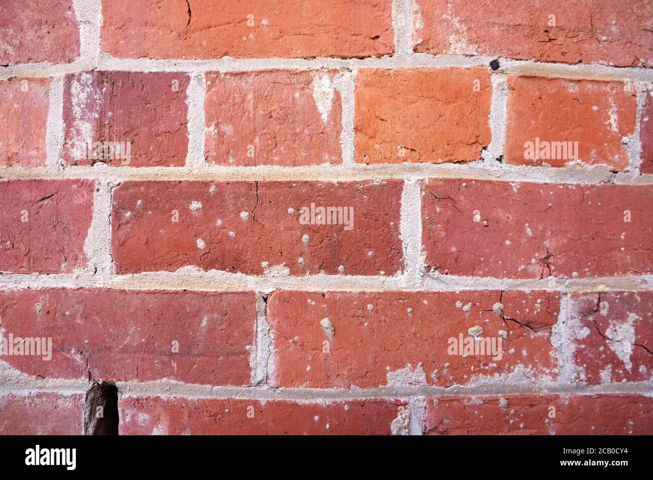 Red brick wall background showing vintage bricks, hole and abstract ...