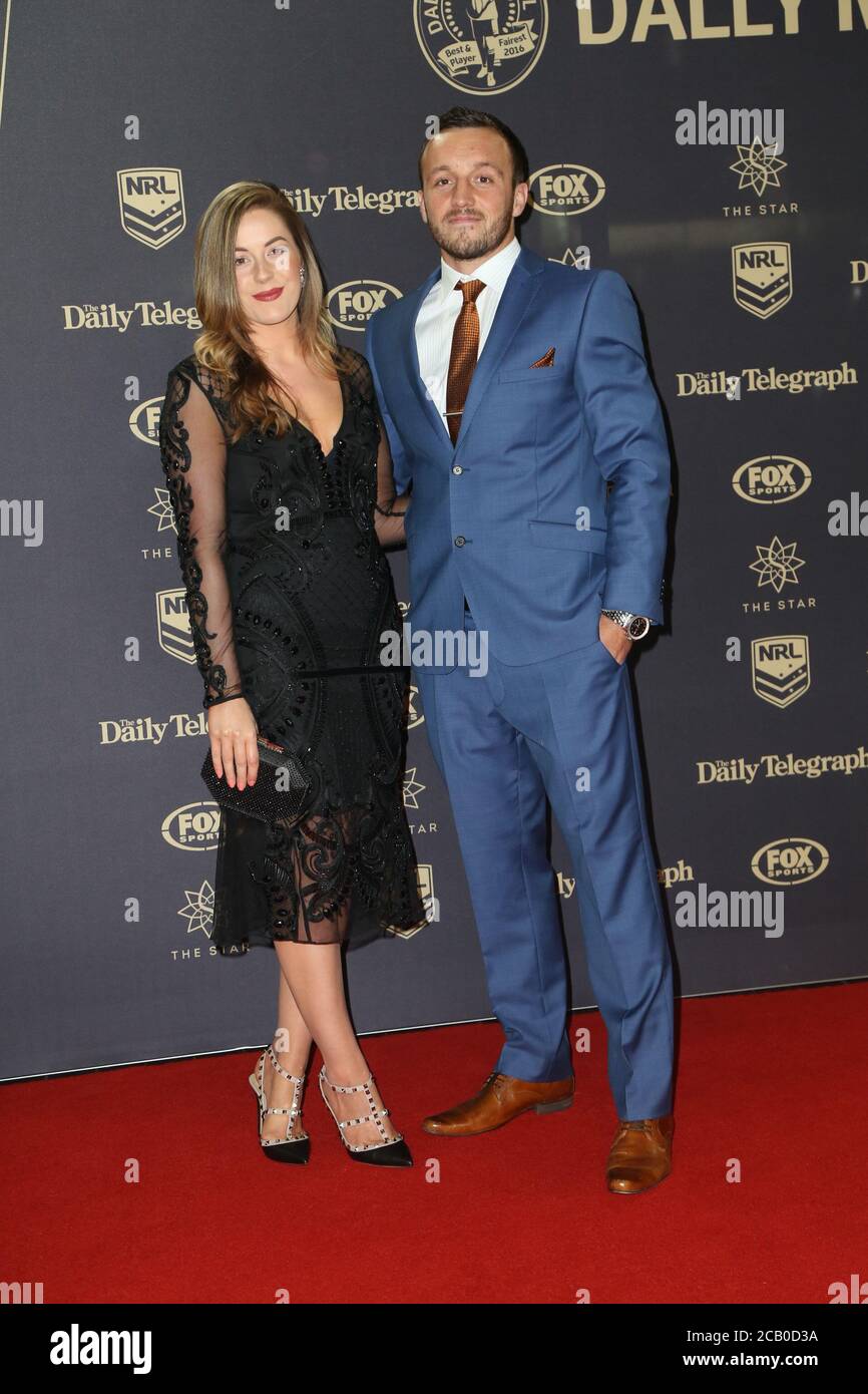 Josh Hodgson of the Canberra Raiders and partner Kirby Smith arrives on ...