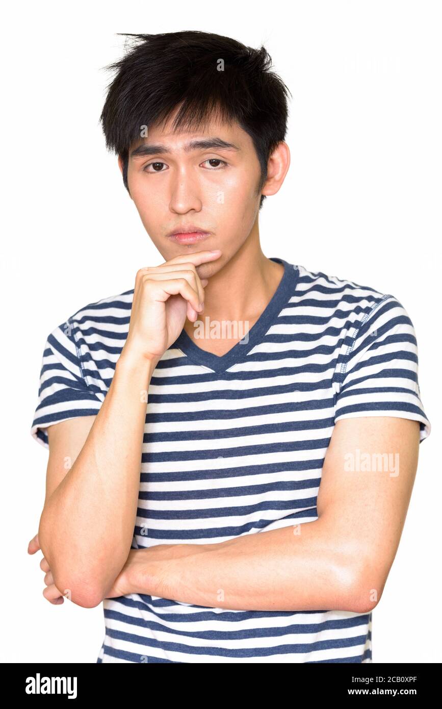 Portrait of young handsome Asian man thinking Stock Photo - Alamy