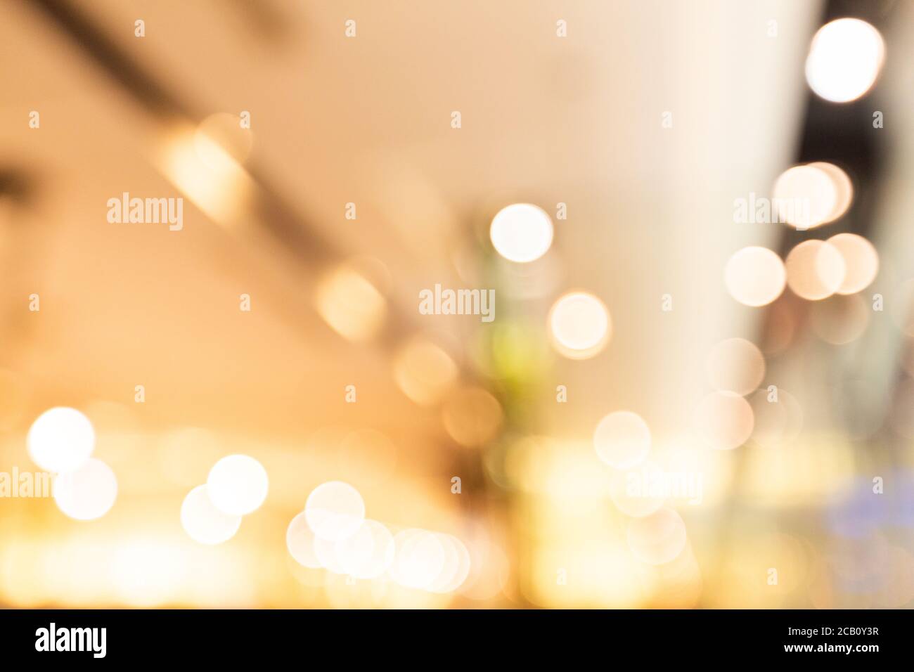 Abstract blur lights in retail shop mall background. Interior clean ...