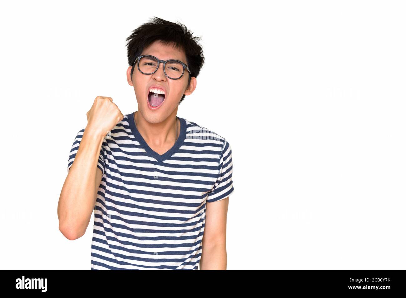 Studio shot of happy Asian nerd guy isolated against white background ...