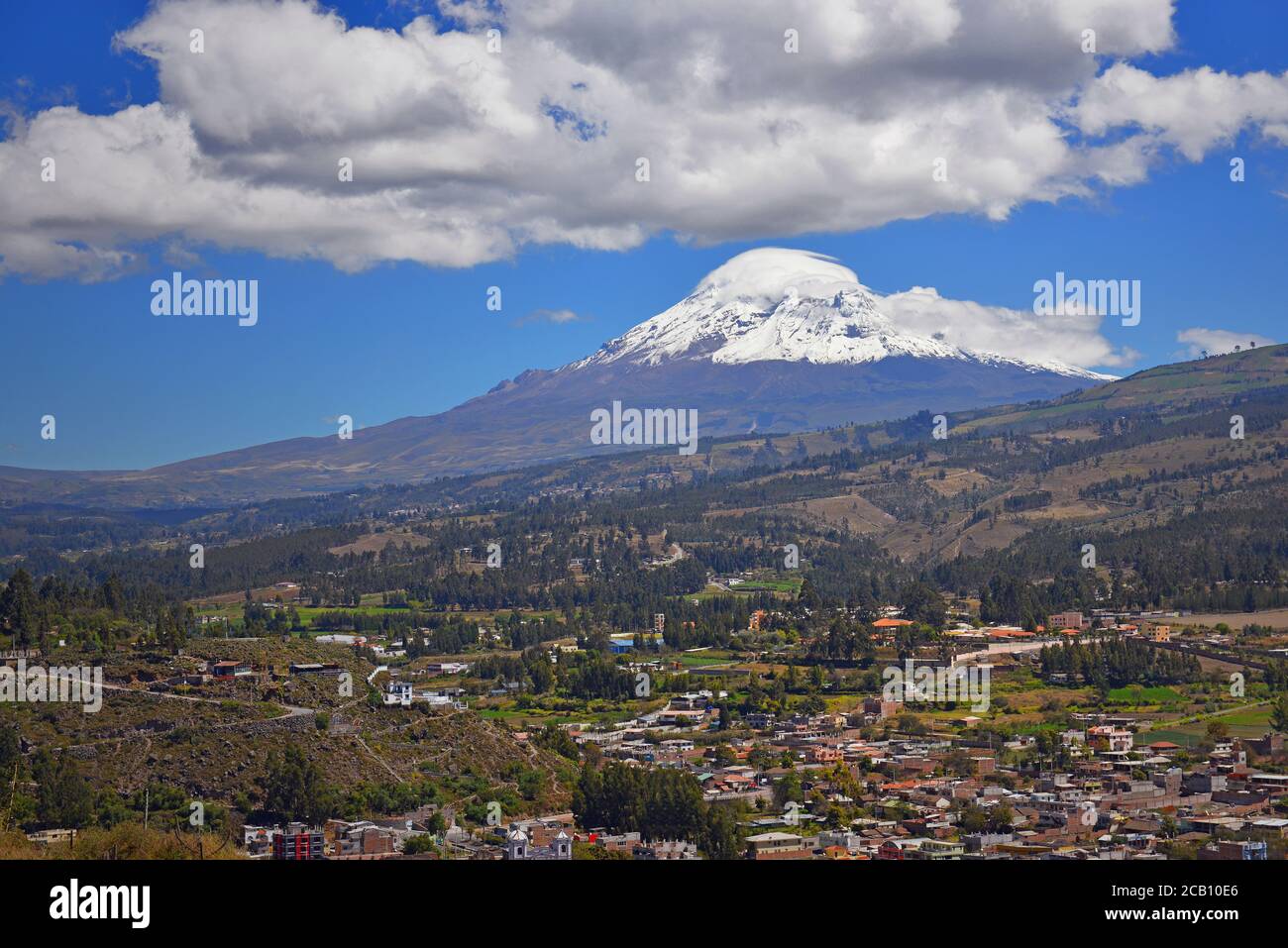 The Chimborazo volcano and the village of Guano, Ecuador Stock Photo ...