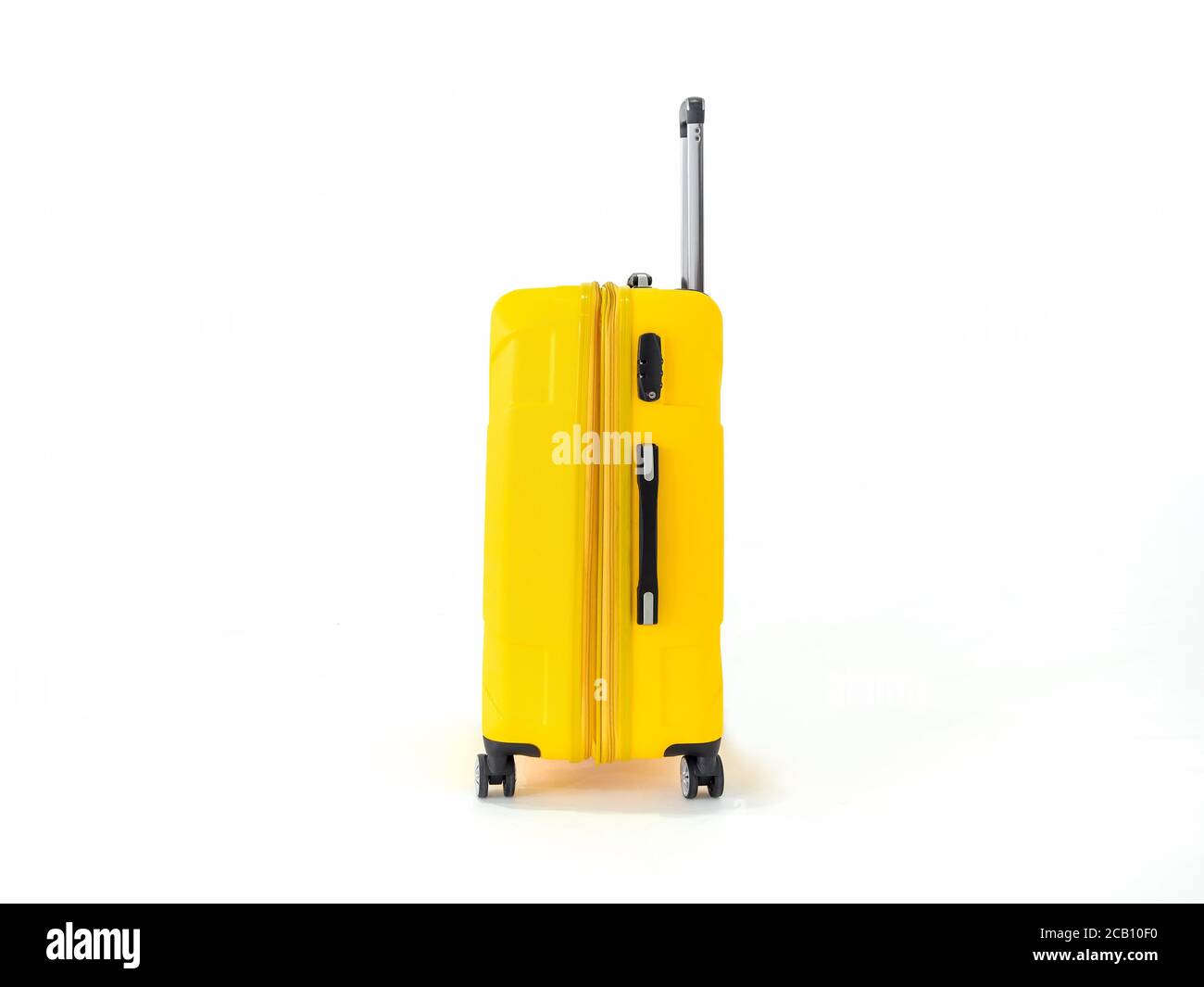 Yellow suitcase on side view isolated on white background. Large yellow ...