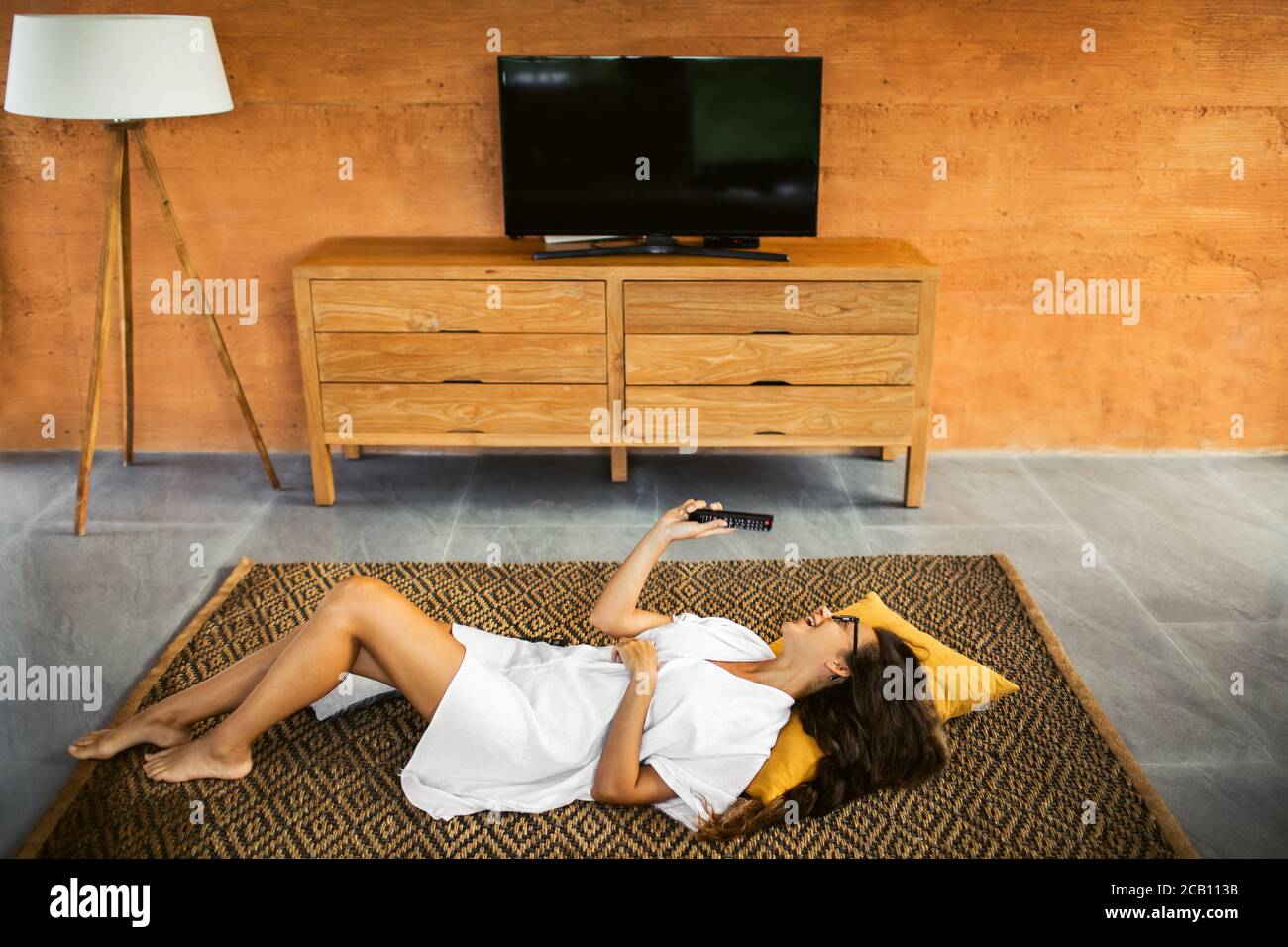 Entertainment at home, tv addiction. Stay home. Smiling happy woman ...