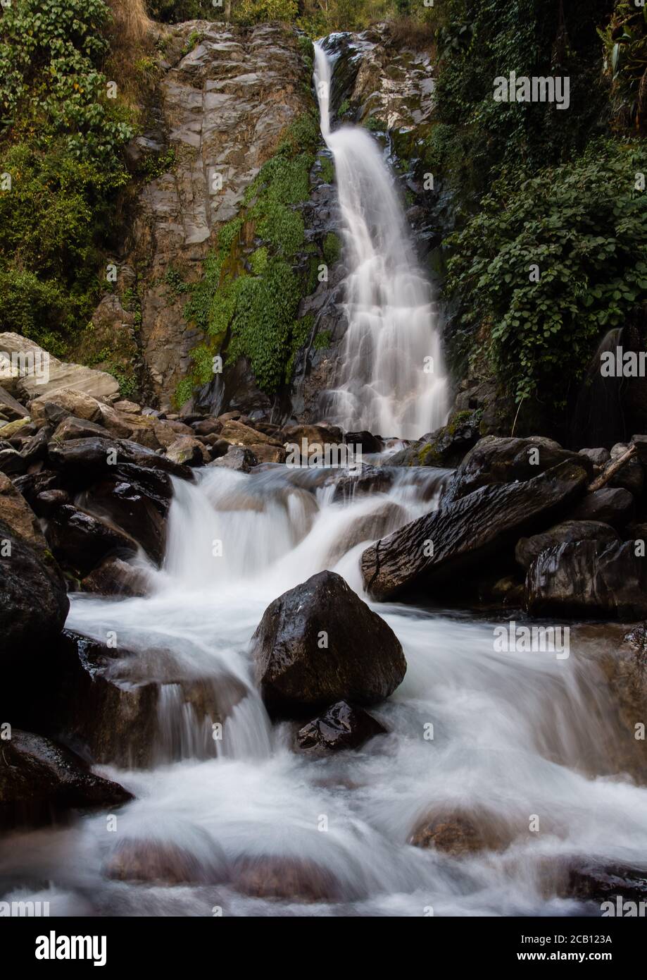 Waterfall with long exposure showing smooth flowing water going over ...