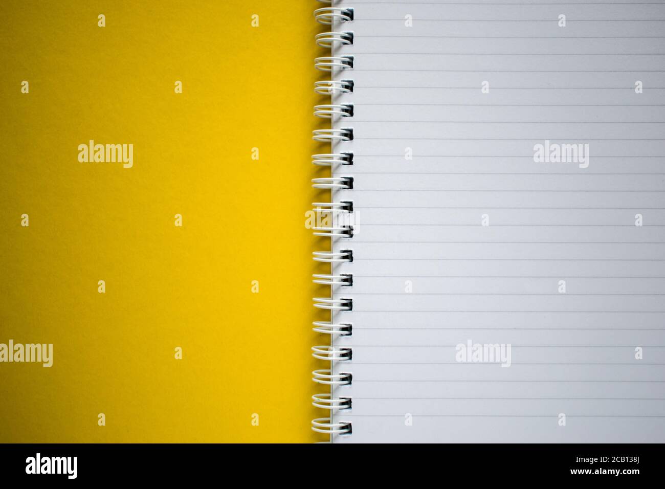 Cut out white notepad on yellow background Stock Photo - Alamy
