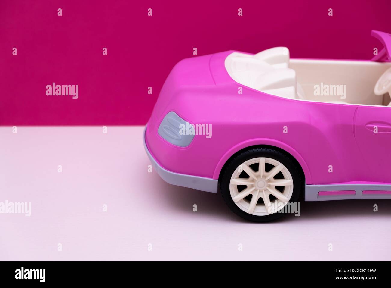 pink car on a pink background. Concept of car sale, car rental or car ...