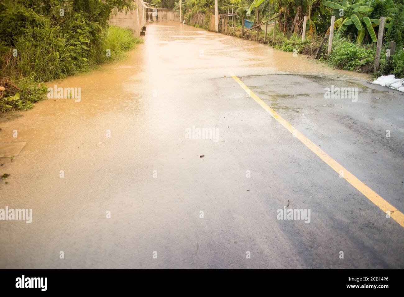 Flooding on the asphalt road from monsoon depression Stock Photo - Alamy