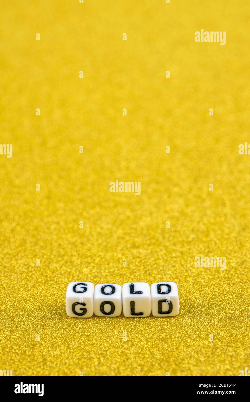 gold word formed by white dices with black letters laying in bottom ...