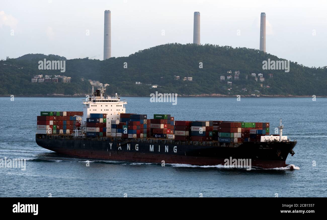Container ships transporting cargo into Hong Kong from mainland China ...