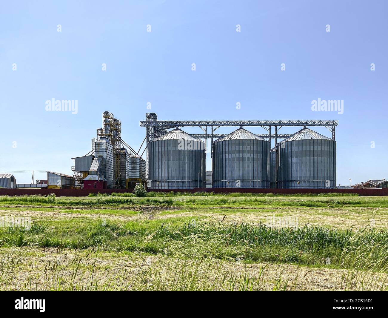 grain elevator, granary. large steel towers for storing crops against ...
