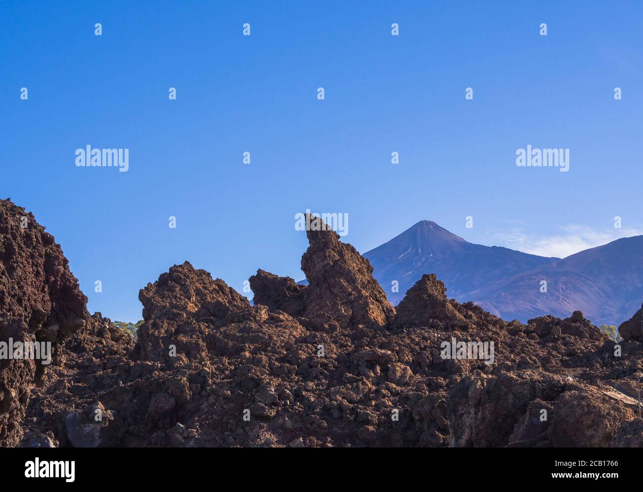 view on top of colorful volcano pico del teide highest spanish mountain from lava rock formation ...