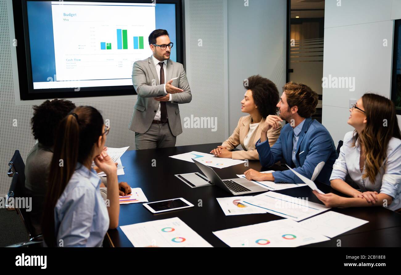 Portrait of successful business team working in office Stock Photo - Alamy