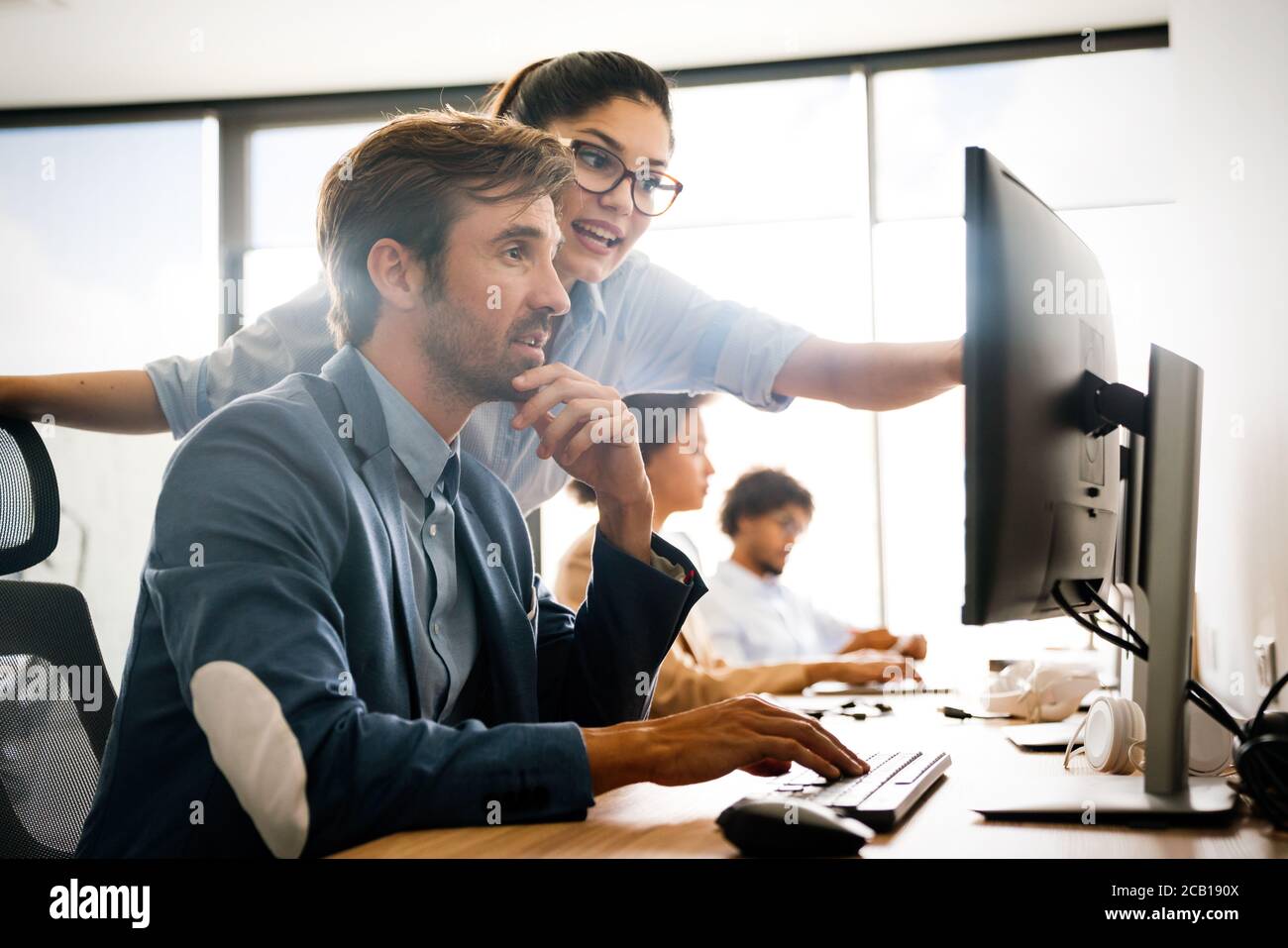 Programmer working in a software developing company Stock Photo - Alamy