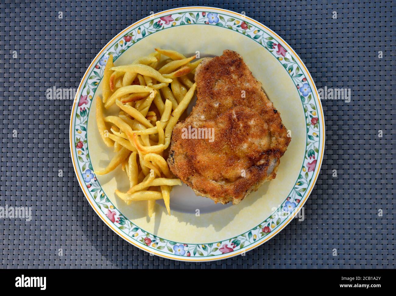 Breaded cutlet, pork with Swabian potato noodles on plate, Baden ...