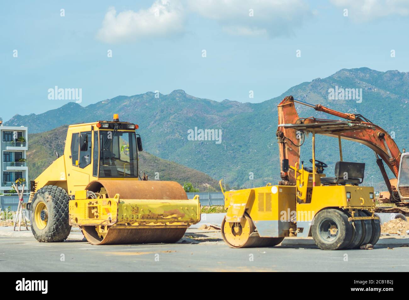 Large view on the big and small yellow road rollers working on the new ...